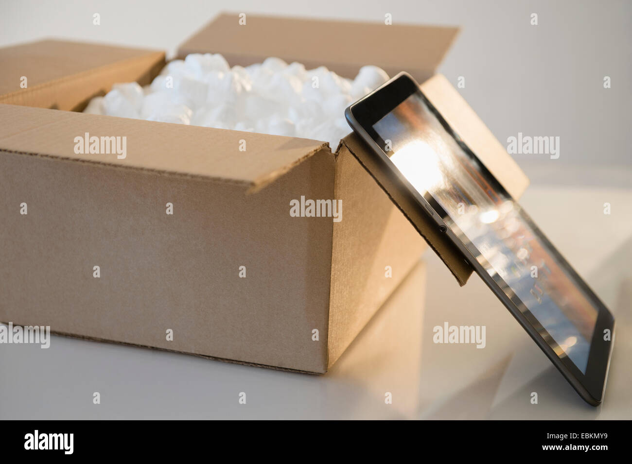 Digital tablet and box Stock Photo - Alamy
