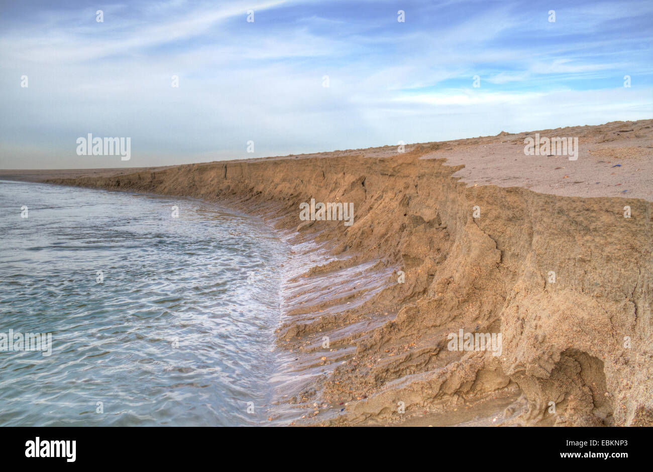 Erosion of sand by a stream on the beach Stock Photo - Alamy