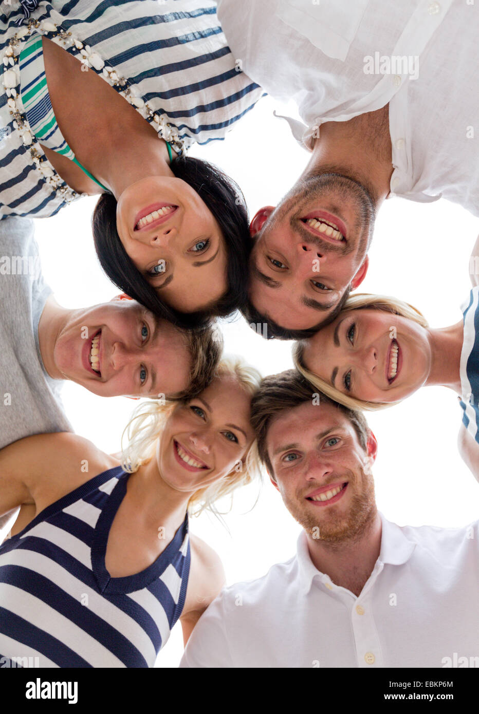 smiling friends in circle Stock Photo - Alamy