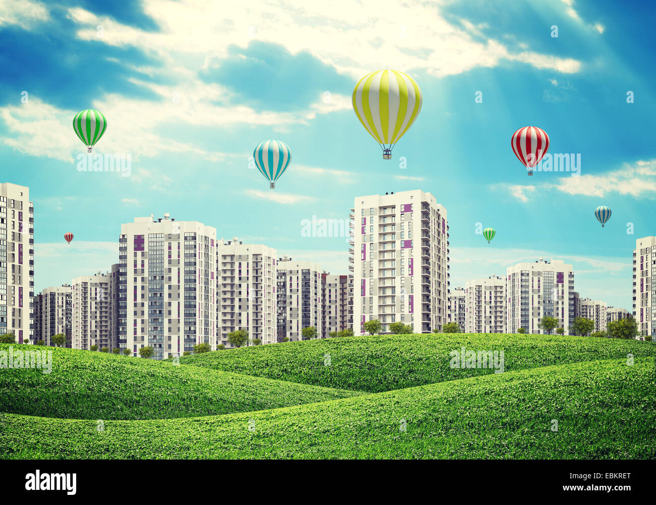 high-rise buildings over green hills, air balloons above Stock Photo ...