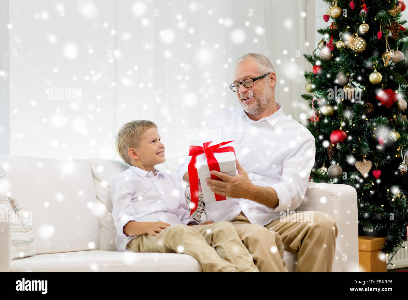 smiling grandfather and grandson at home Stock Photo - Alamy