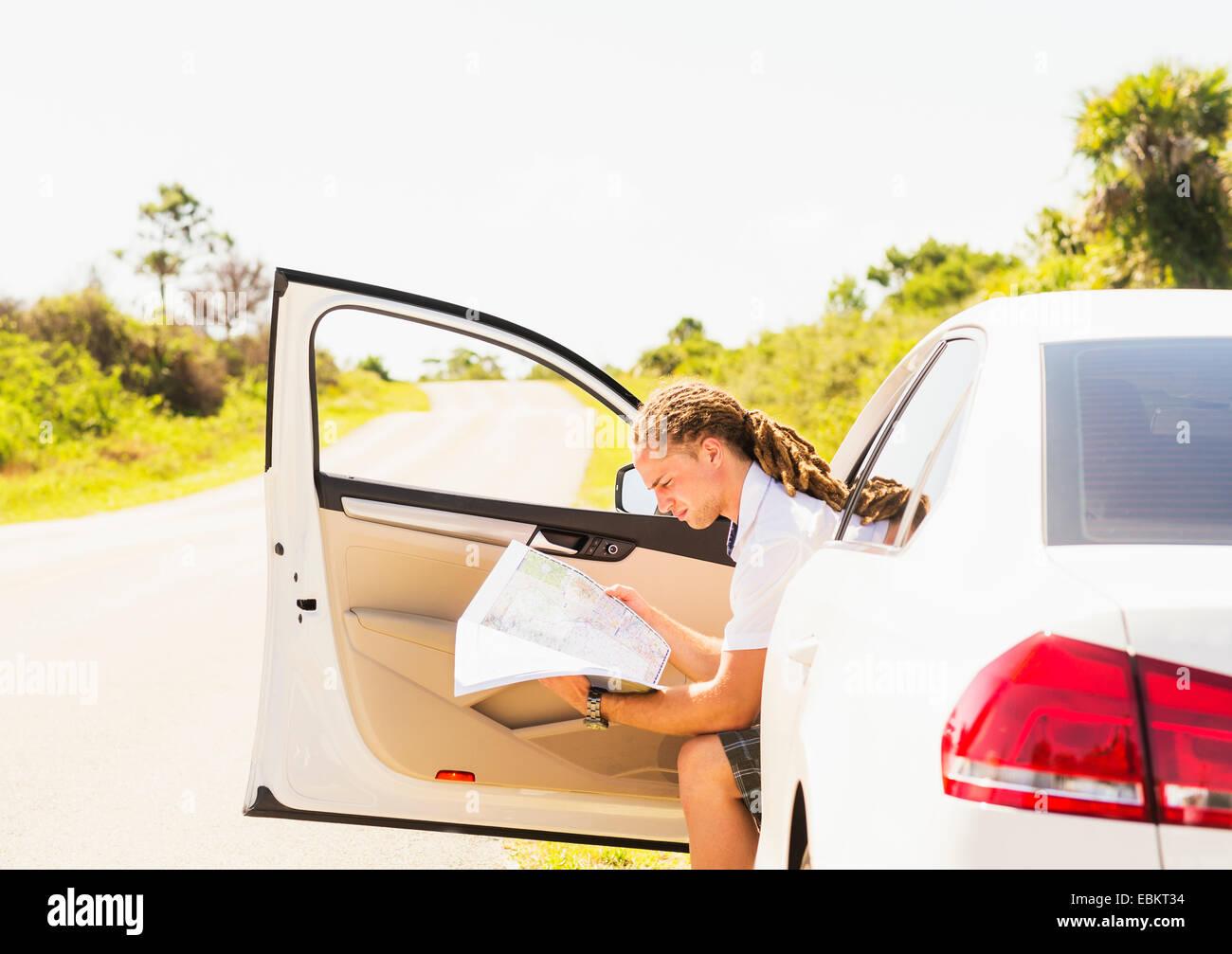 USA, Florida, Tequesta, Young man checking map Stock Photo - Alamy