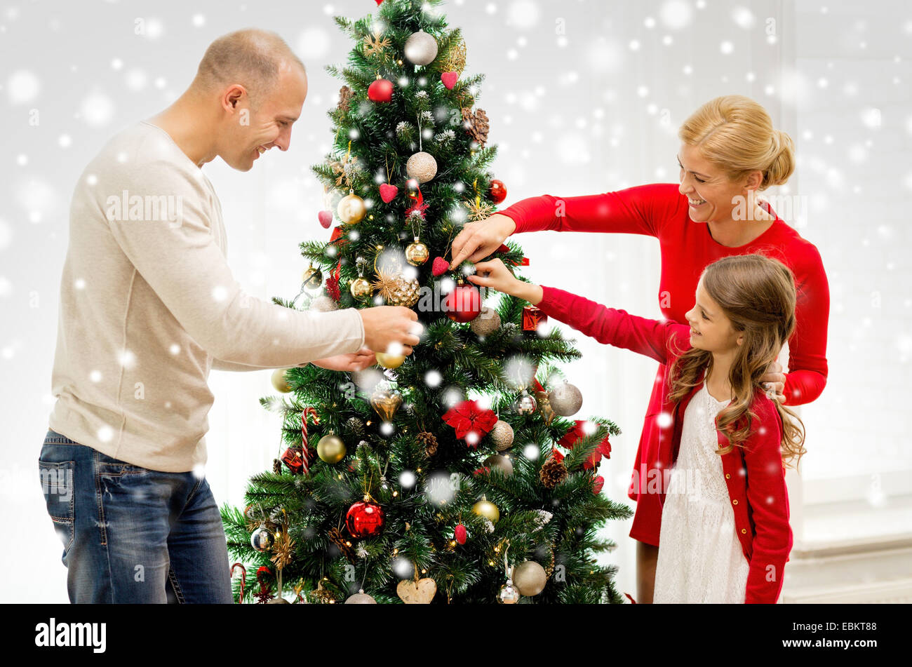 Family at christmas tree hi-res stock photography and images - Alamy