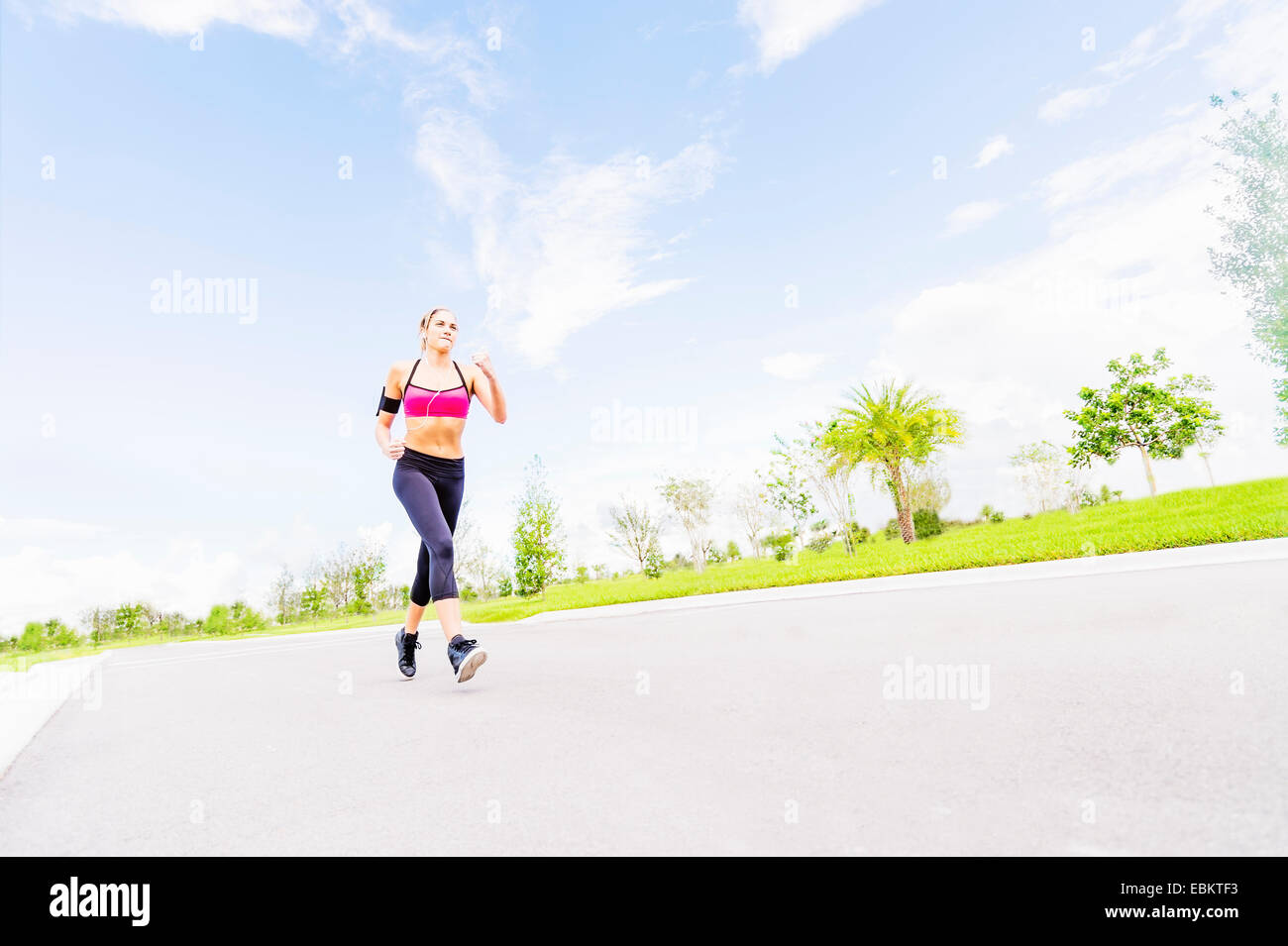 Woman jogging low angle hi-res stock photography and images - Alamy