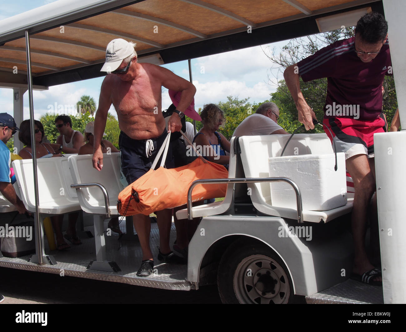 Beachgoers de-boarding tram from beach at Lover’s Key State Park, Ft ...