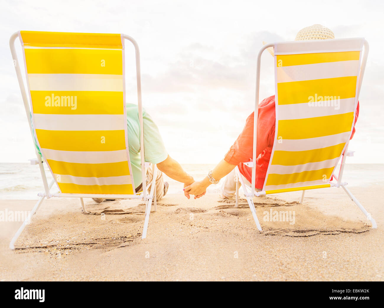 People sitting in beach chairs hi-res stock photography and images - Alamy