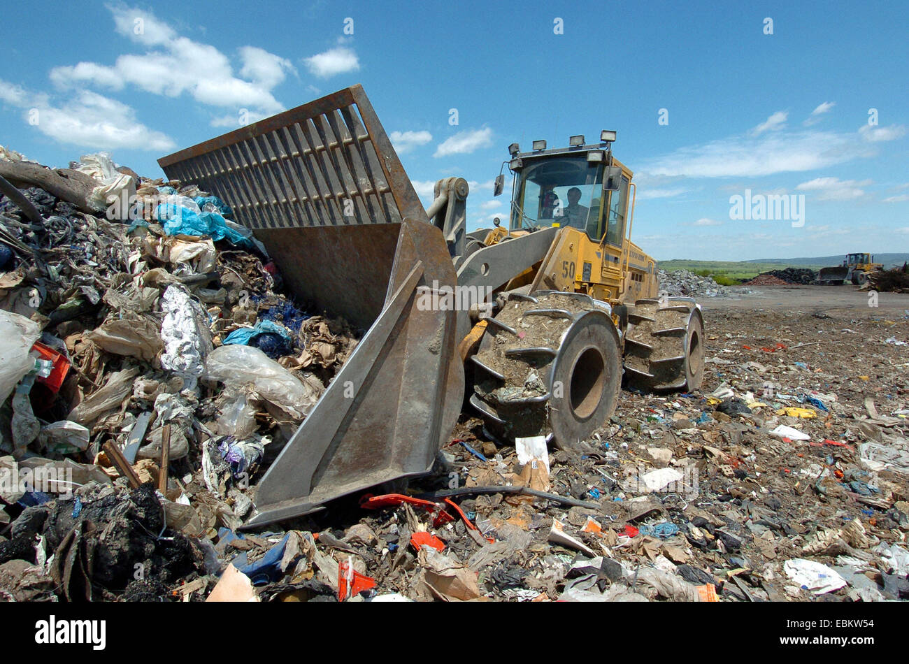 Excavator on a dumping ground hi-res stock photography and images - Alamy