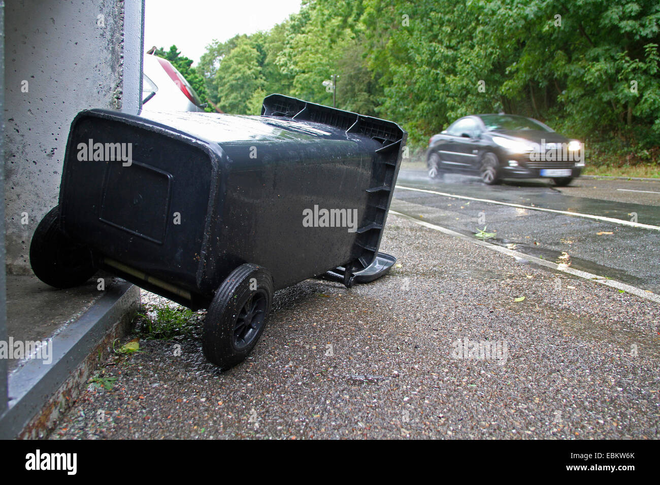 dustbin overturned at a road in storm and rain, Germany Stock Photo - Alamy