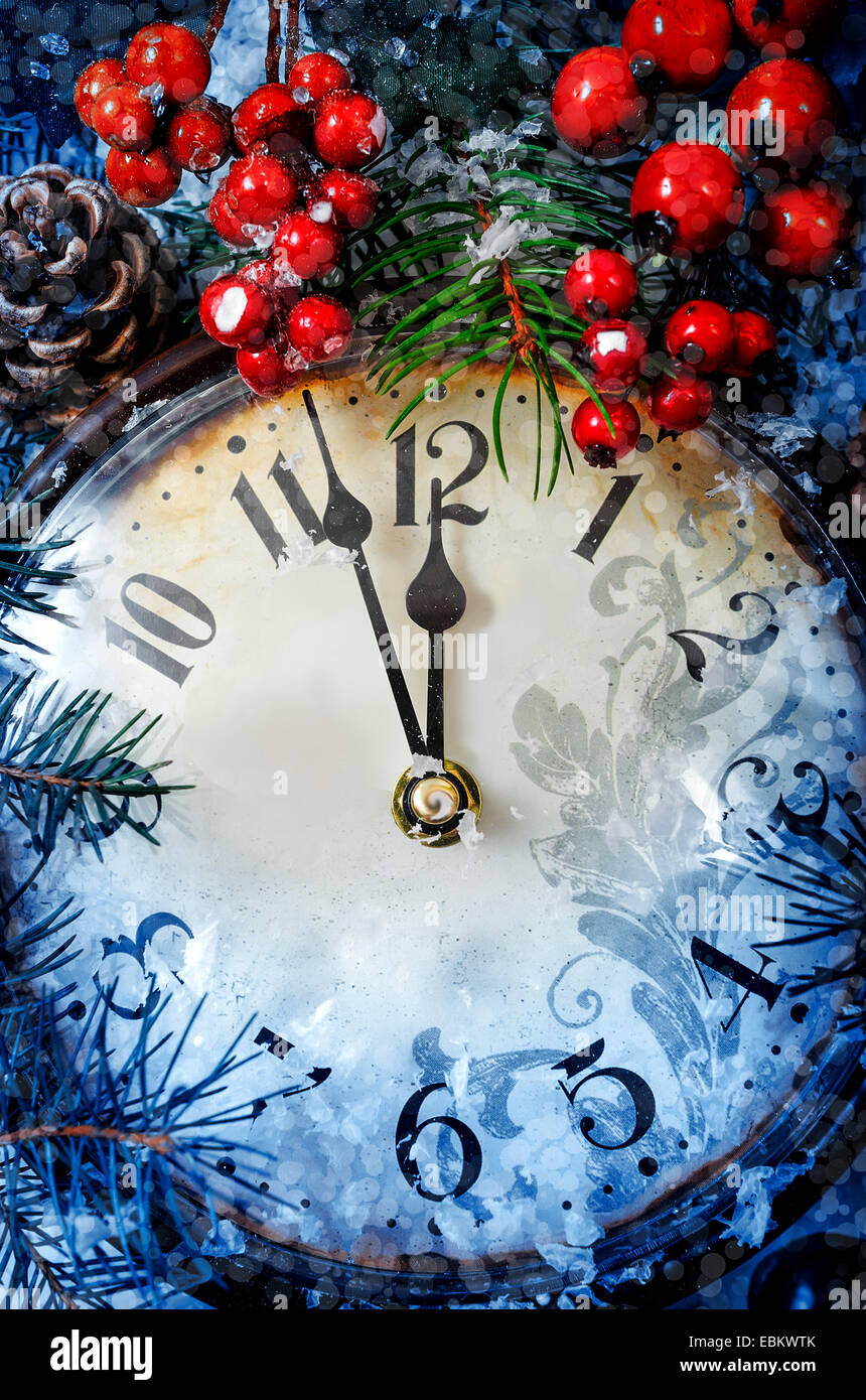 Christmas Eve and New Years at midnight. Clock covered with snow Stock ...