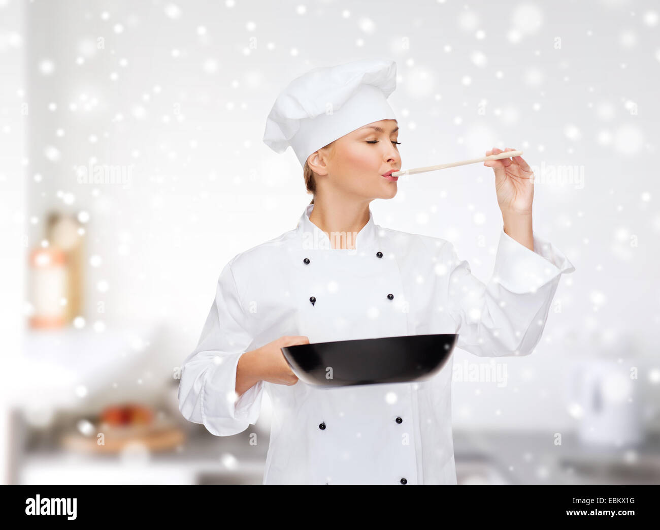smiling female chef with pan and spoon Stock Photo - Alamy