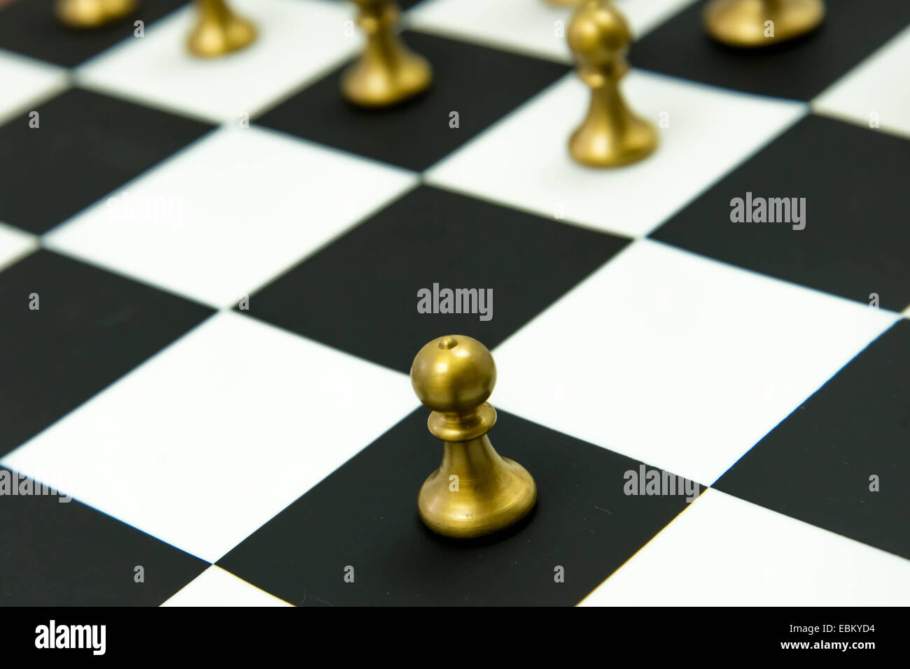 Classic chess game - pawn alone in front on chessboard Stock Photo - Alamy