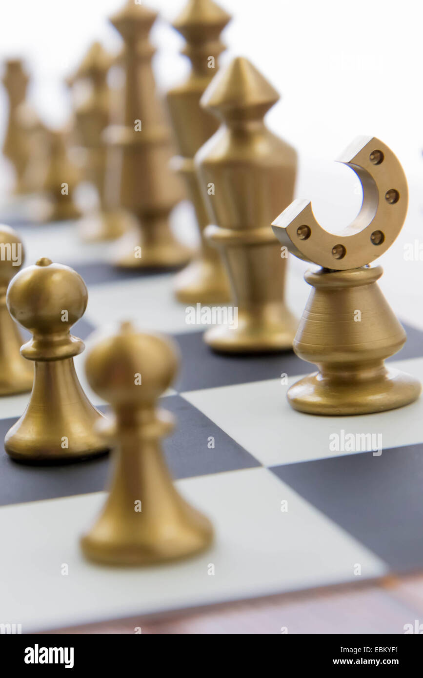 Classic chess game - gold playing pieces lined up on chessboard Stock ...