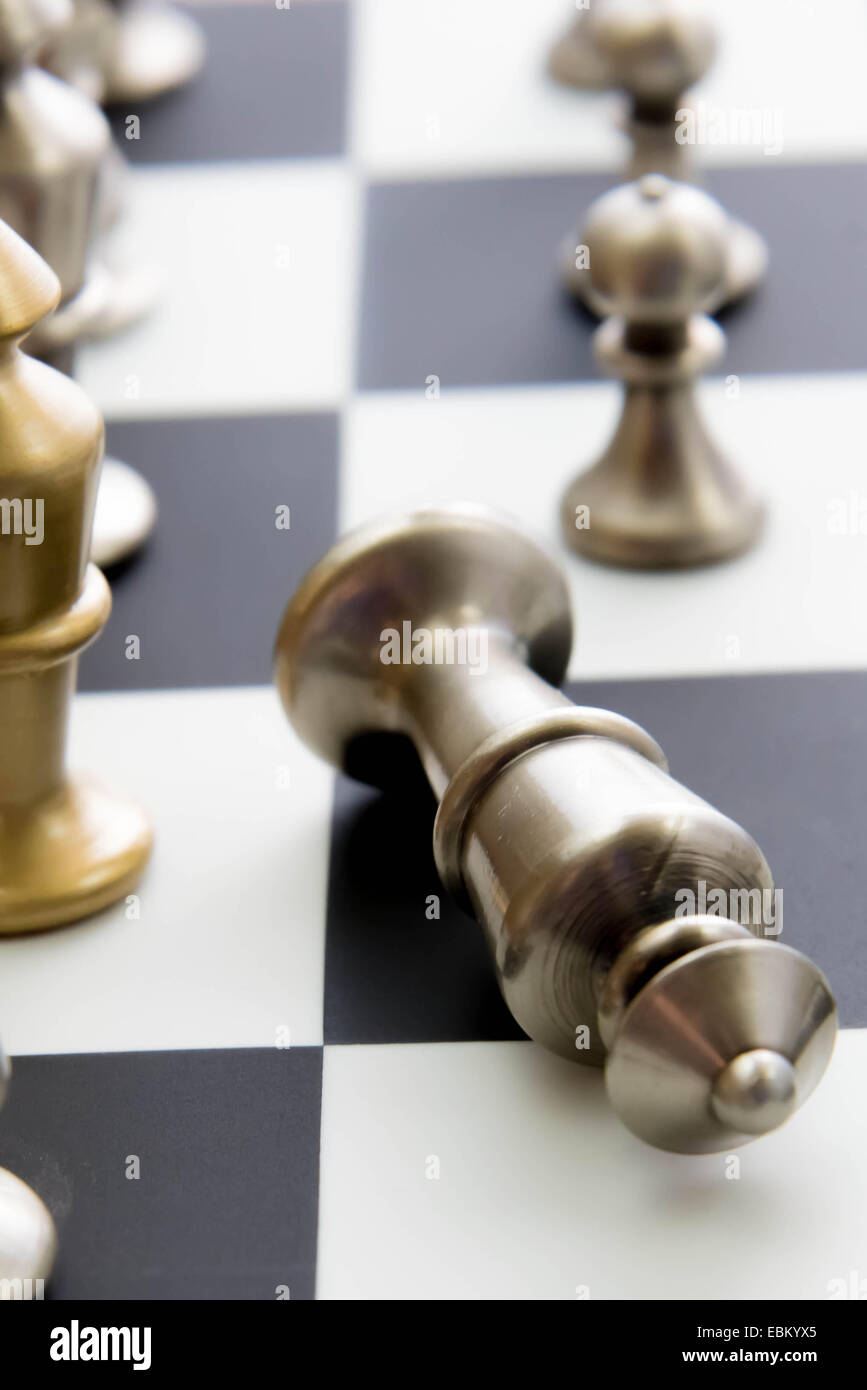 Classic chess game - fallen silver king on chessboard Stock Photo - Alamy