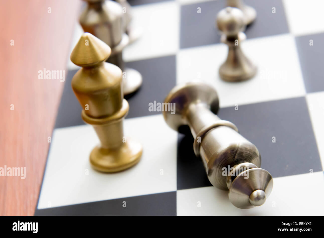 Classic chess game - fallen silver king on chessboard Stock Photo - Alamy