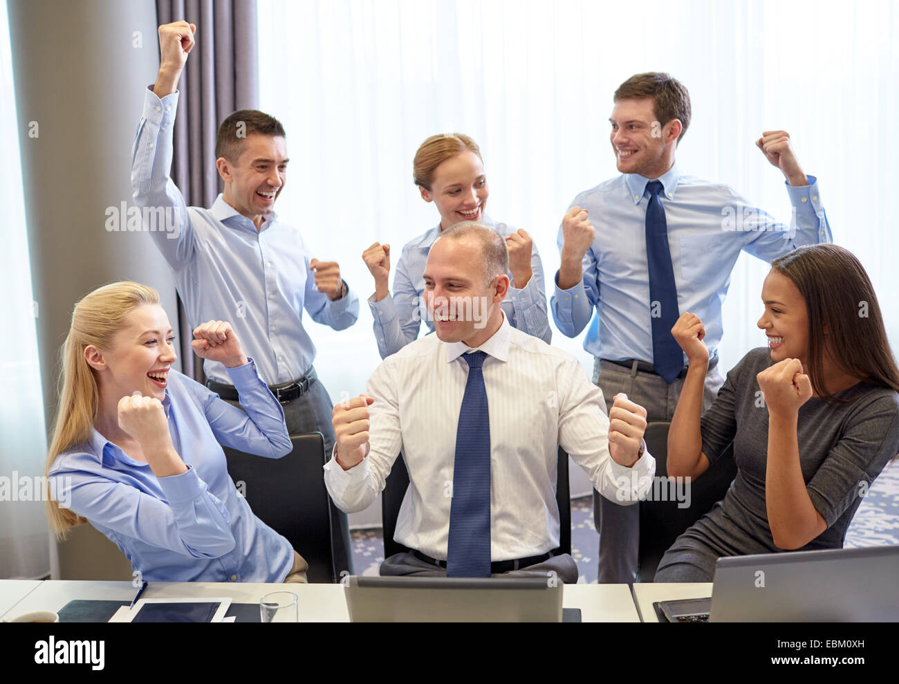 business people celebrating victory in office Stock Photo - Alamy