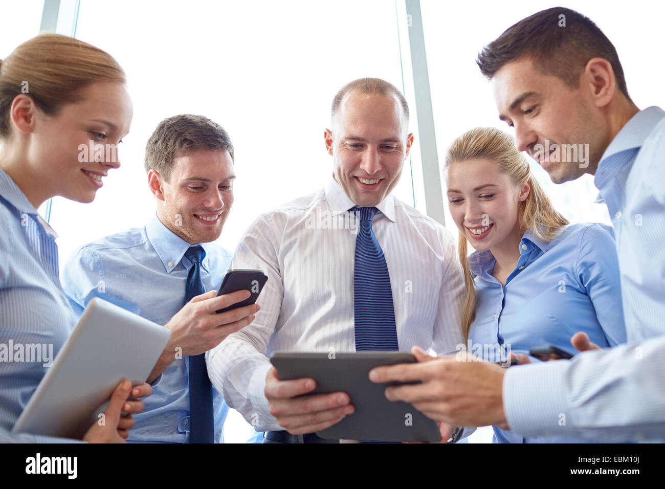 business people with tablet pc and smartphones Stock Photo - Alamy