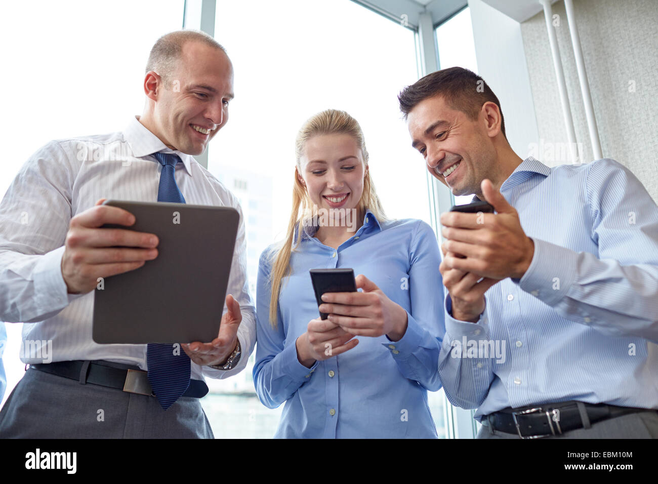 business people with tablet pc and smartphones Stock Photo - Alamy