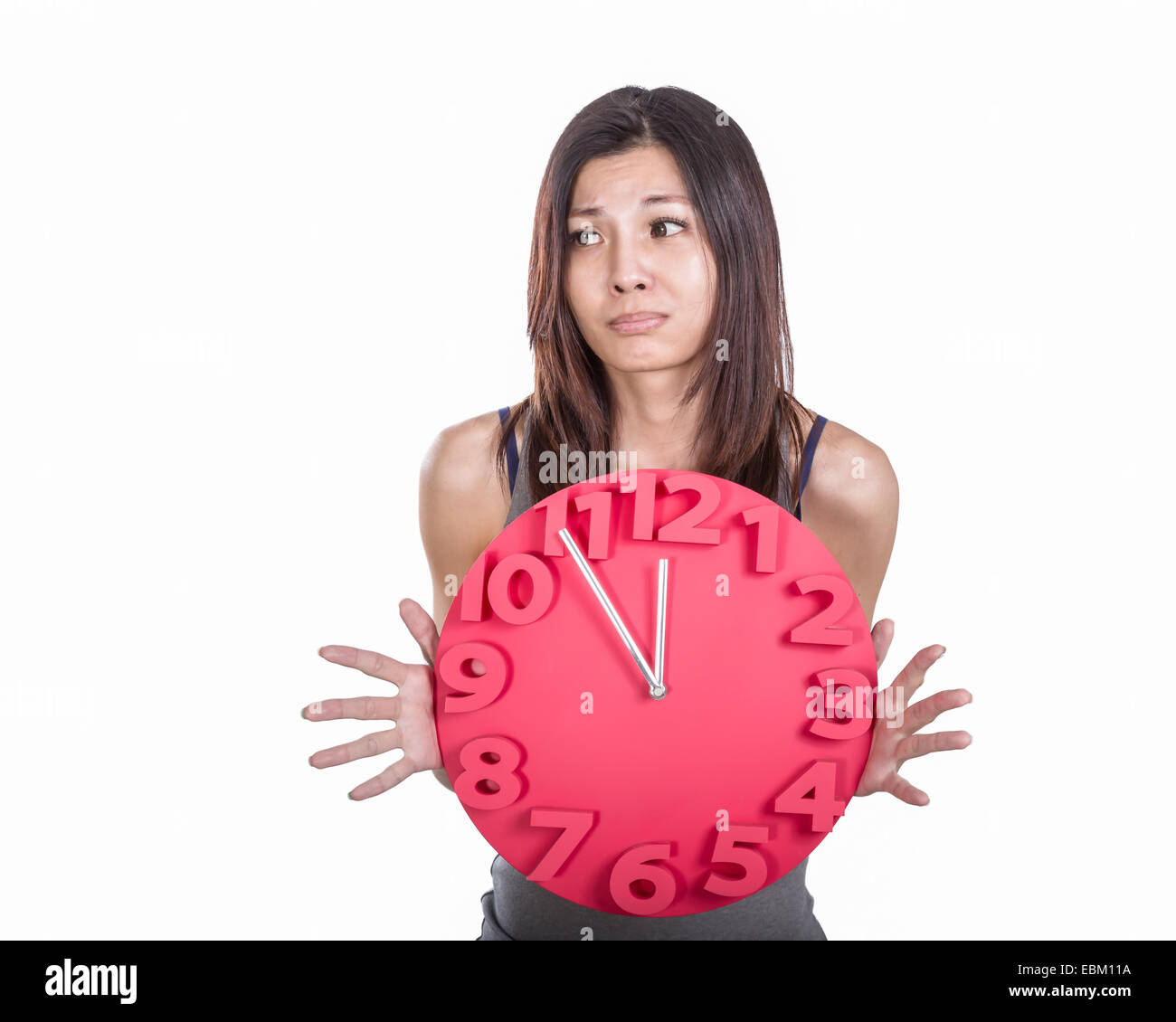 Woman pointing to clock hi-res stock photography and images - Alamy