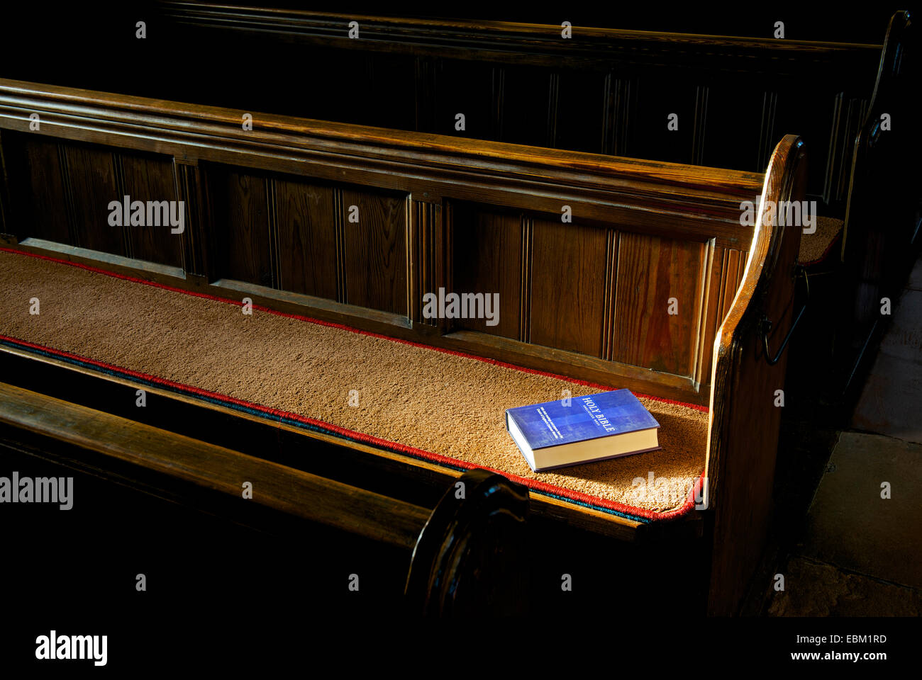 Bible on church pew Stock Photo - Alamy