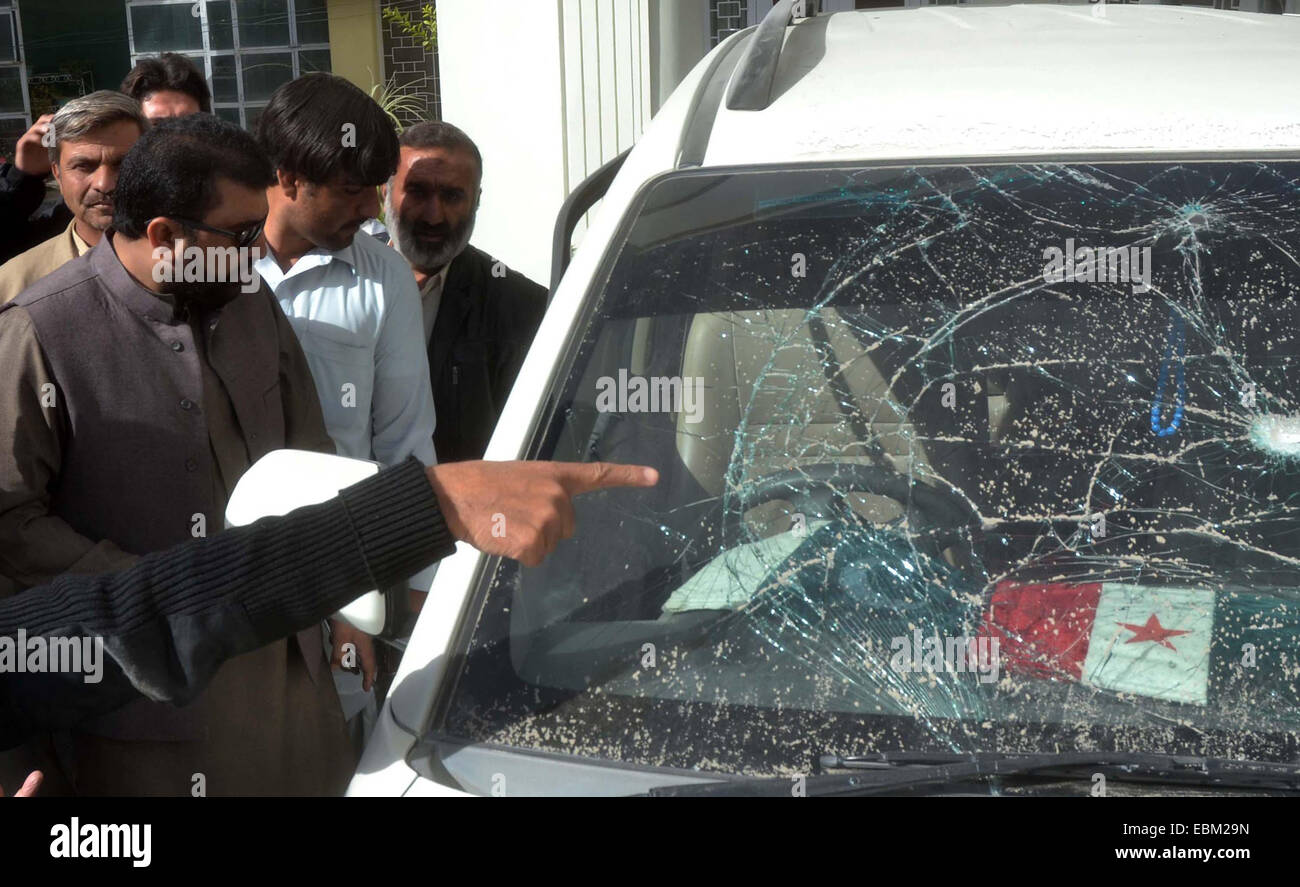 Interior Minister Mir Sarfaraz Bugti inspecting wreckage car after a ...