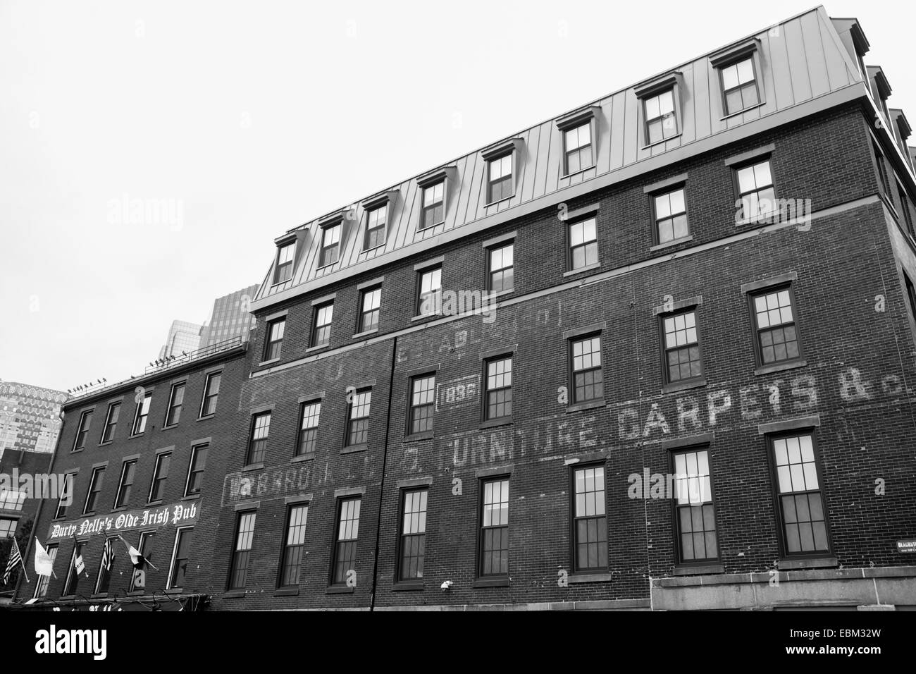 Faded signage on old brick Boston Buildings in black and white in ...