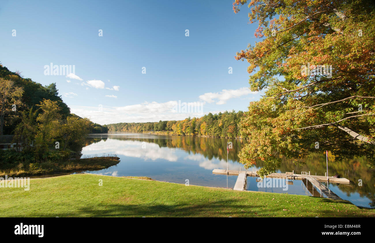 River edge, jetty, and calm water reflection Stock Photo - Alamy