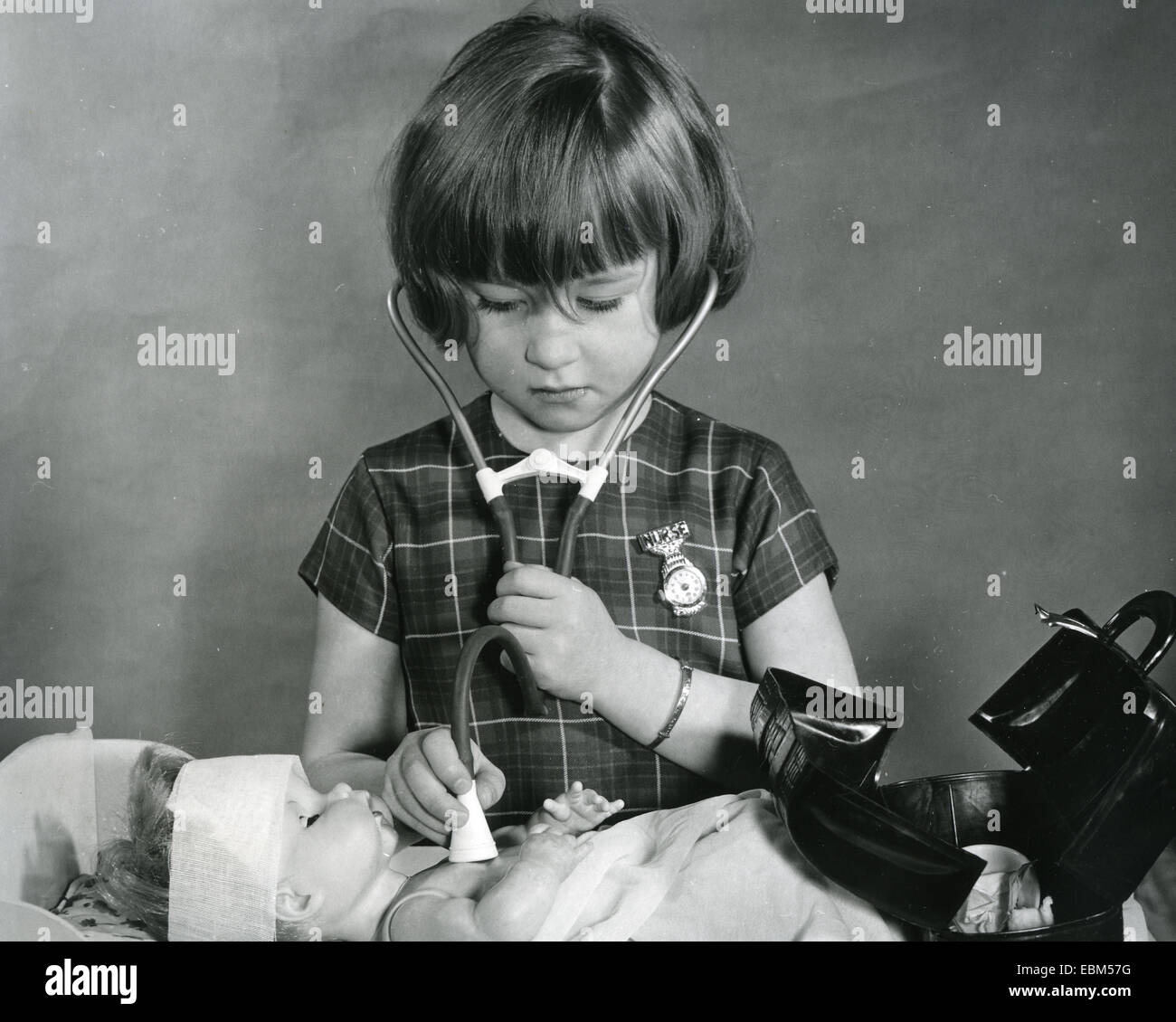 GIRL PLAYING DOCTOR Stock Photo - Alamy