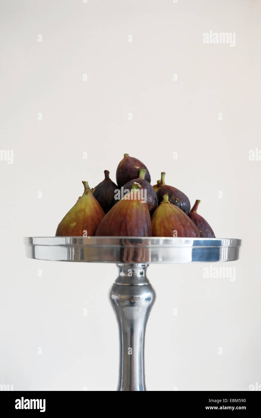 Figs on a silver pedestal Stock Photo - Alamy