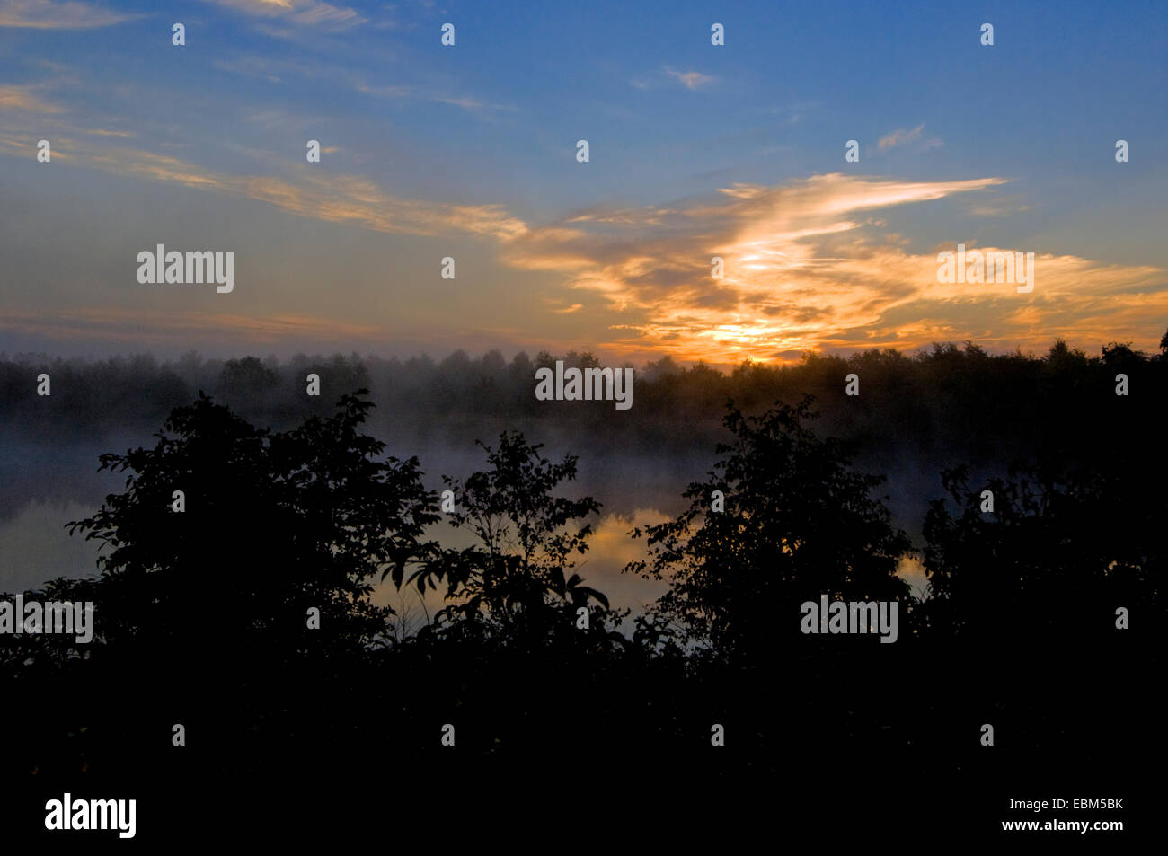 Pond with mist rising at sunrise near Patoka River National Wildlife ...