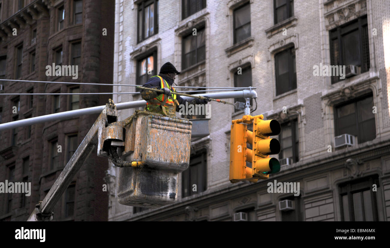 Manhattan New York USA November 2014 - Workman cleaning traffic lights ...