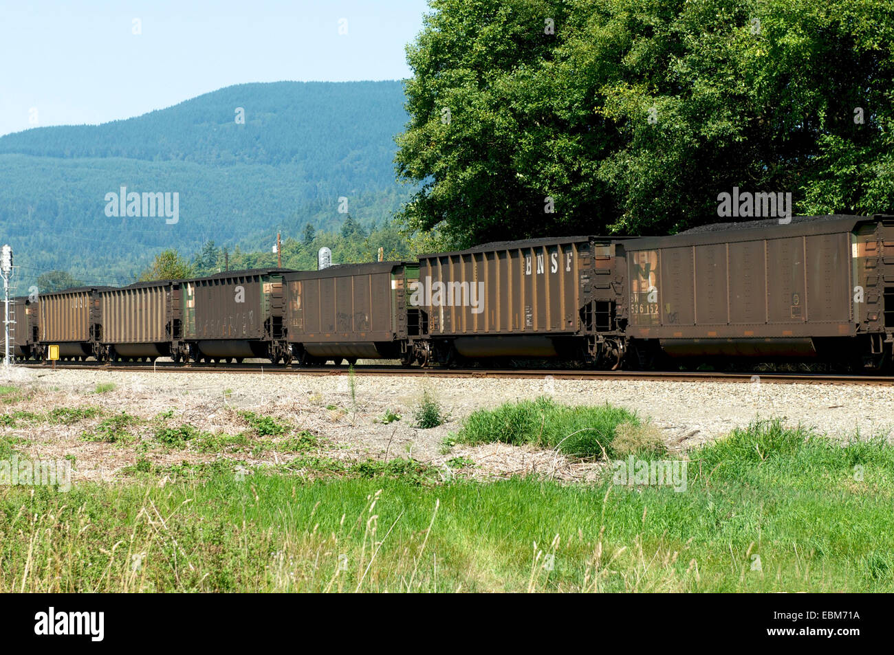 Open top coal train creates pollution concerns Stock Photo - Alamy