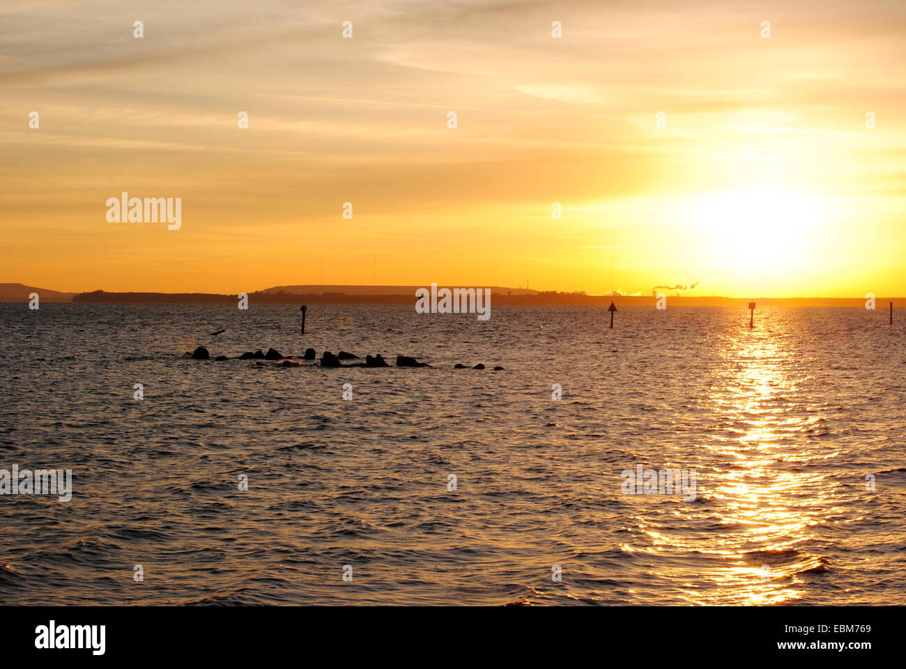 Sunrise,seen at Ballast Point Park,from the Tampa Bay shore line ...