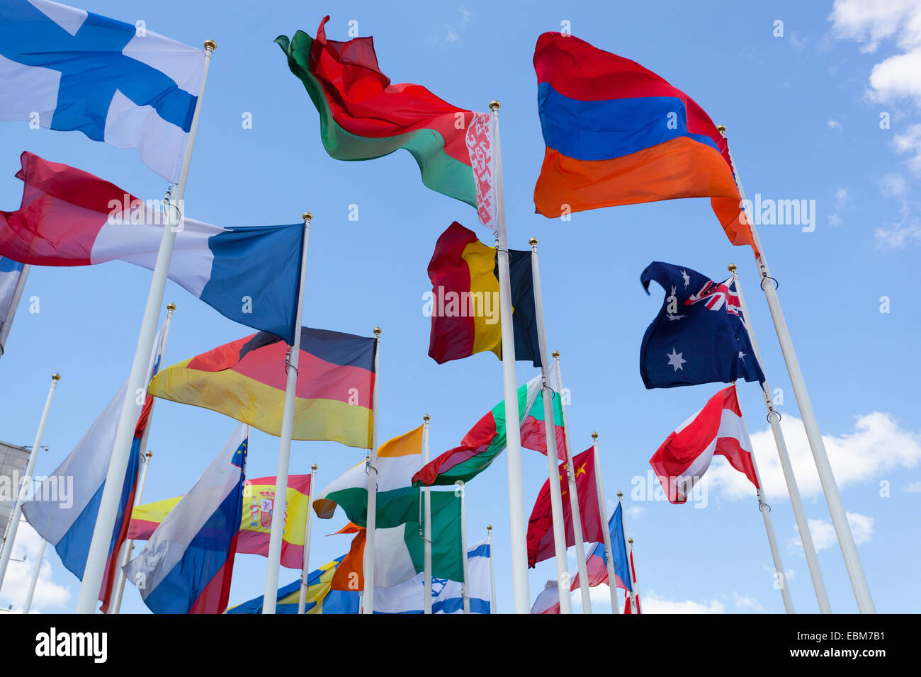Flags of the different countries against the blue sky Stock Photo - Alamy