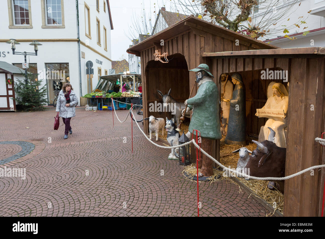 A woman walks past the nativity scene in the town of Harsewinkel ...