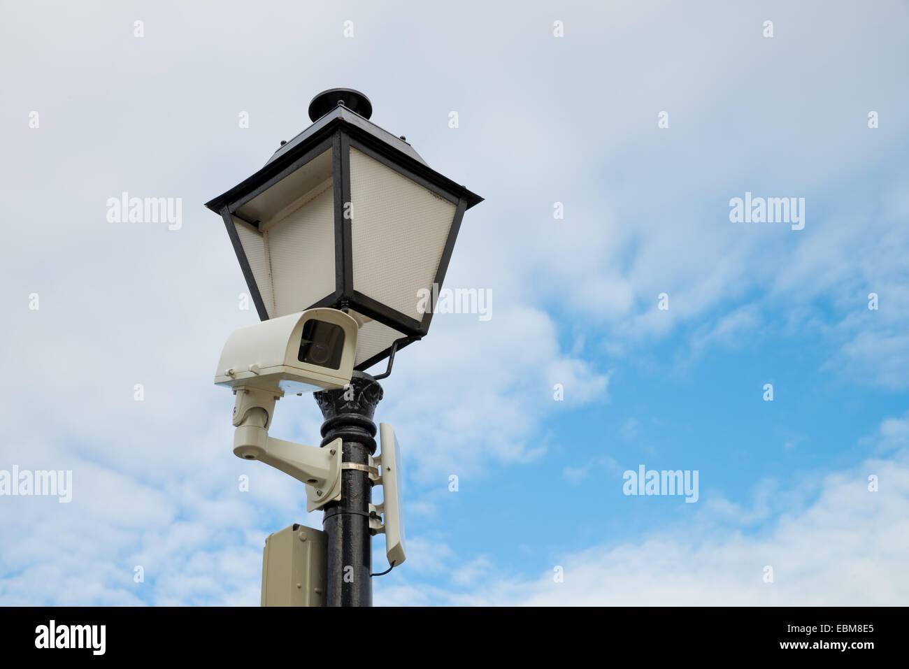 CCTV camera mounted on a classic street lamp Stock Photo - Alamy