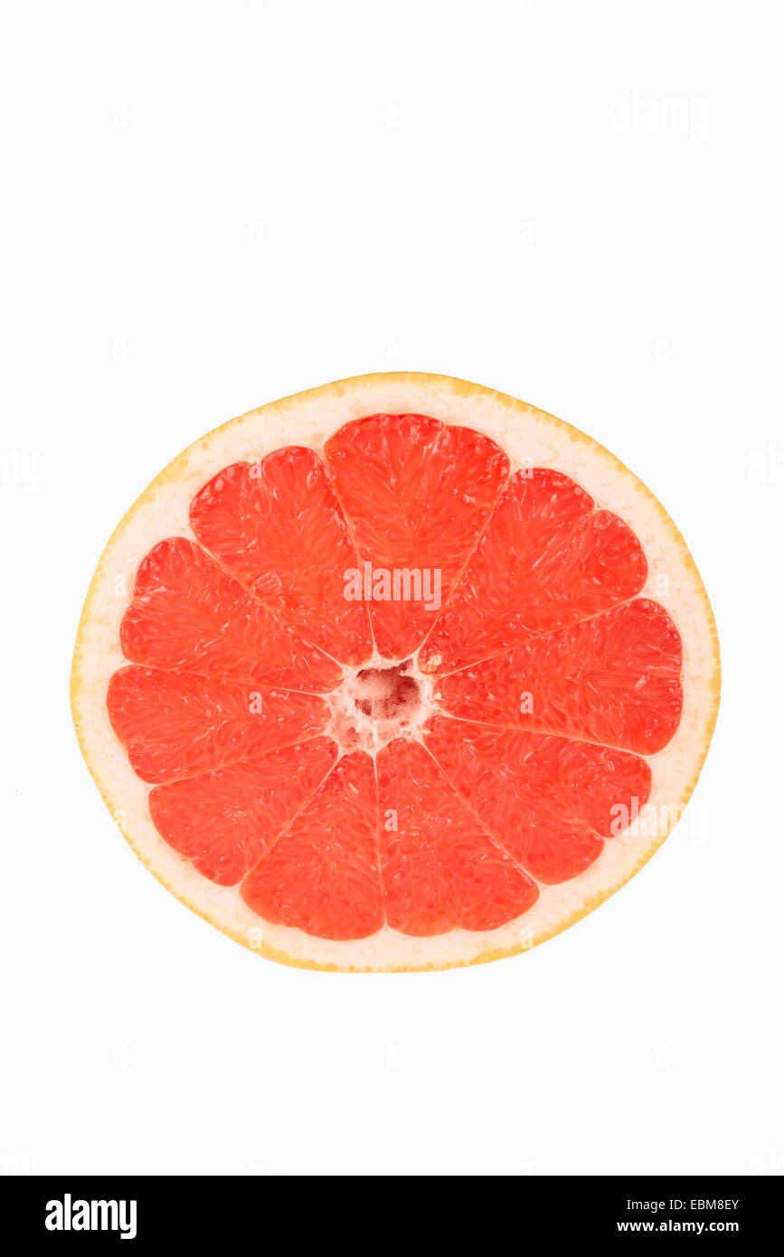 Halved red grapefruit isolated on white, copy space available Stock ...