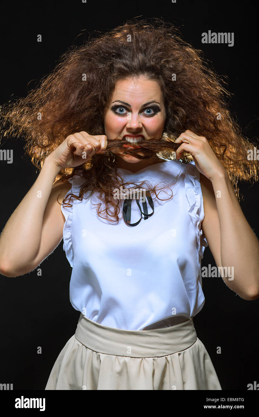 fun woman playing with her hair Stock Photo - Alamy
