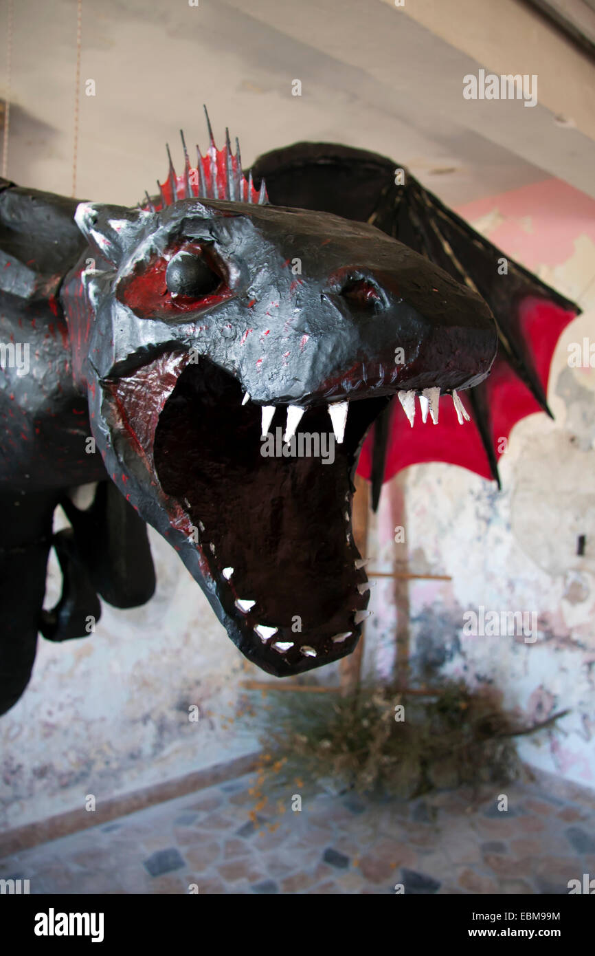 Black dragon with red wings and white teeth sculpture Stock Photo - Alamy
