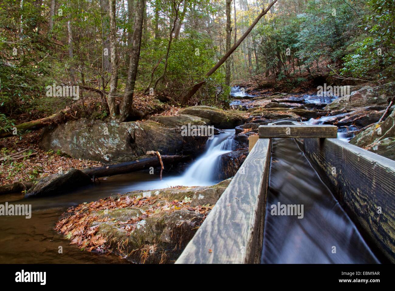 Waterfall feeding a flume for a Pond Stock Photo - Alamy