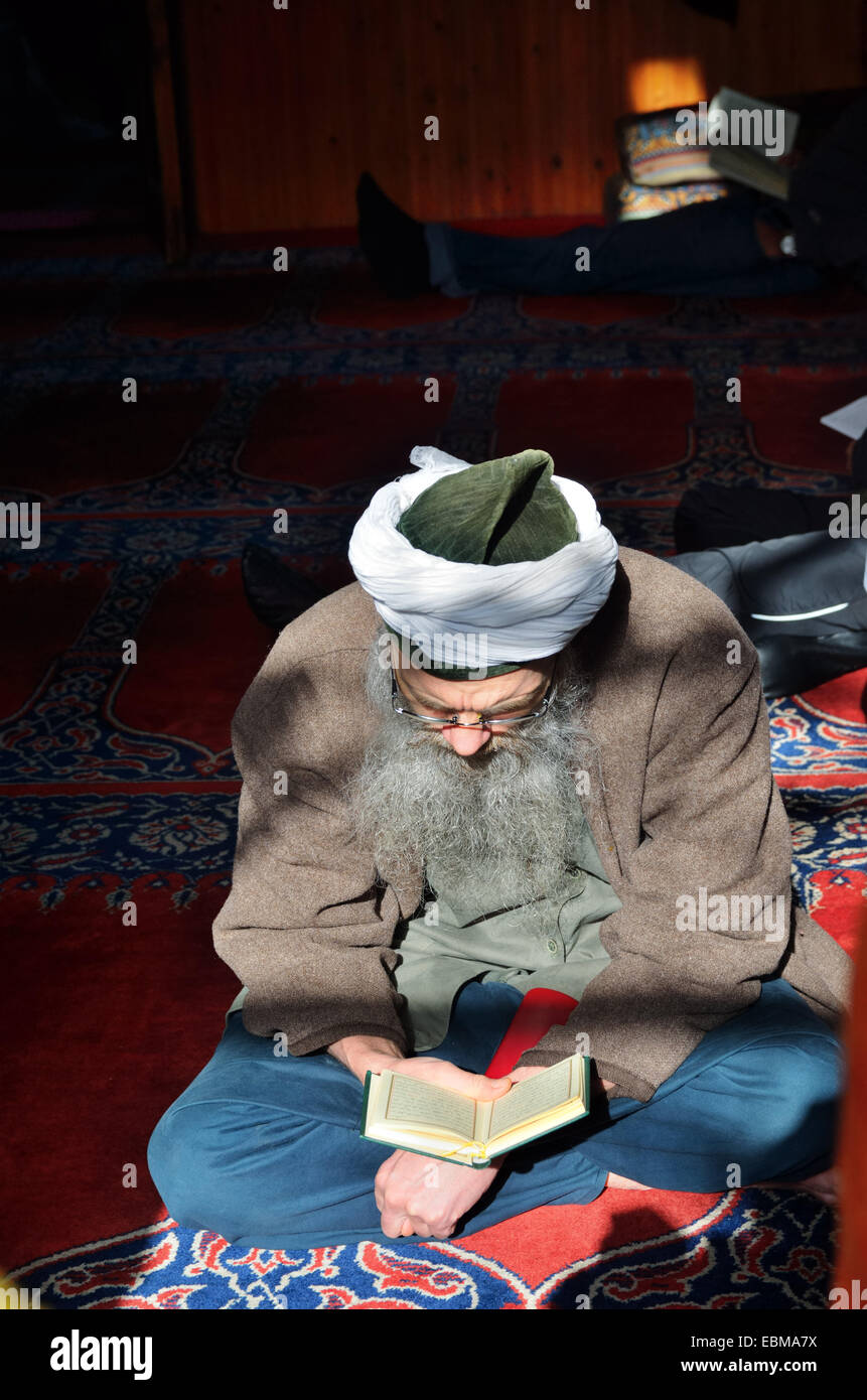 Sufi reads Quran in the mosque inside the residence of Shaikh Nazim Al ...