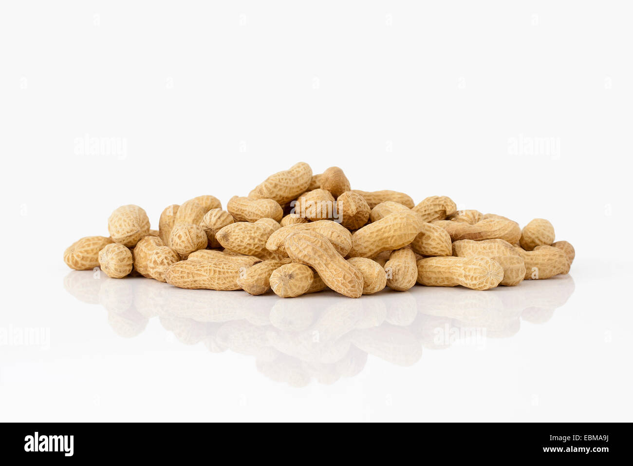 Peanuts on white background Stock Photo - Alamy