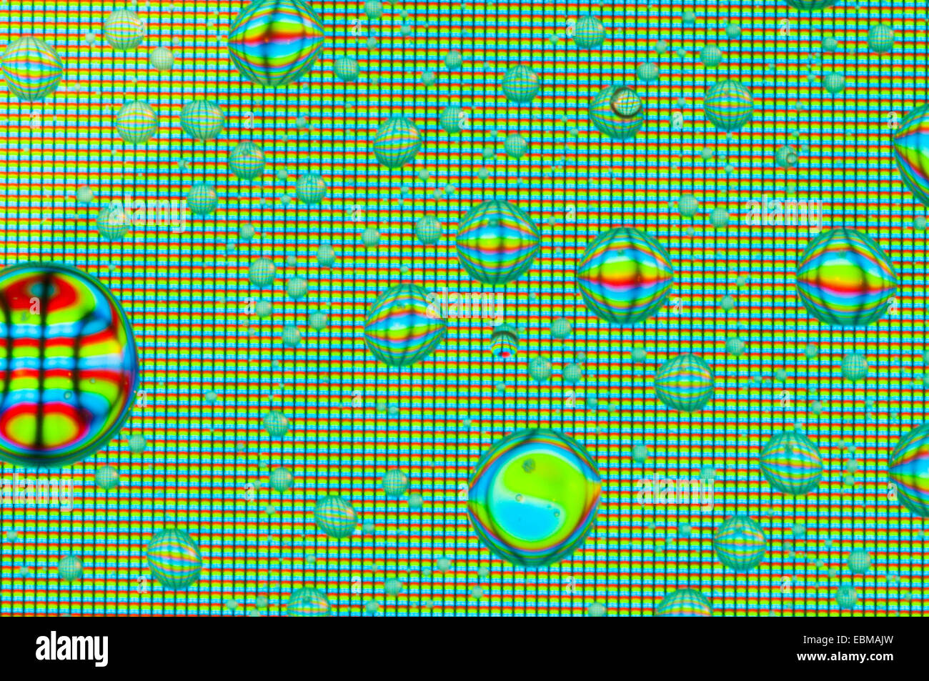 Close up of water droplets on a computer screen. Can be useful in ...