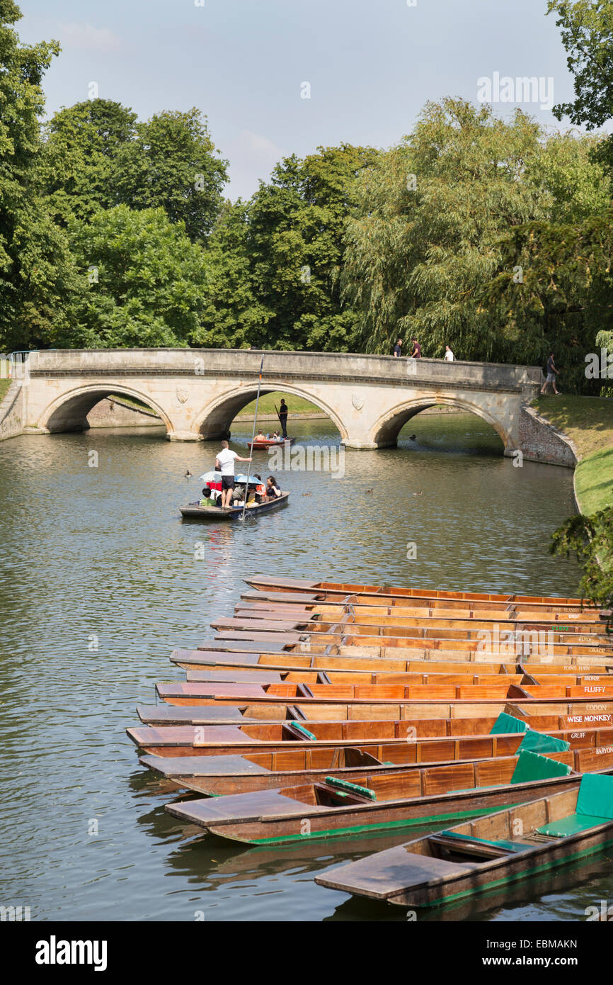 UK, Cambridge, punting on the river Cam, moored punts and Trinity ...