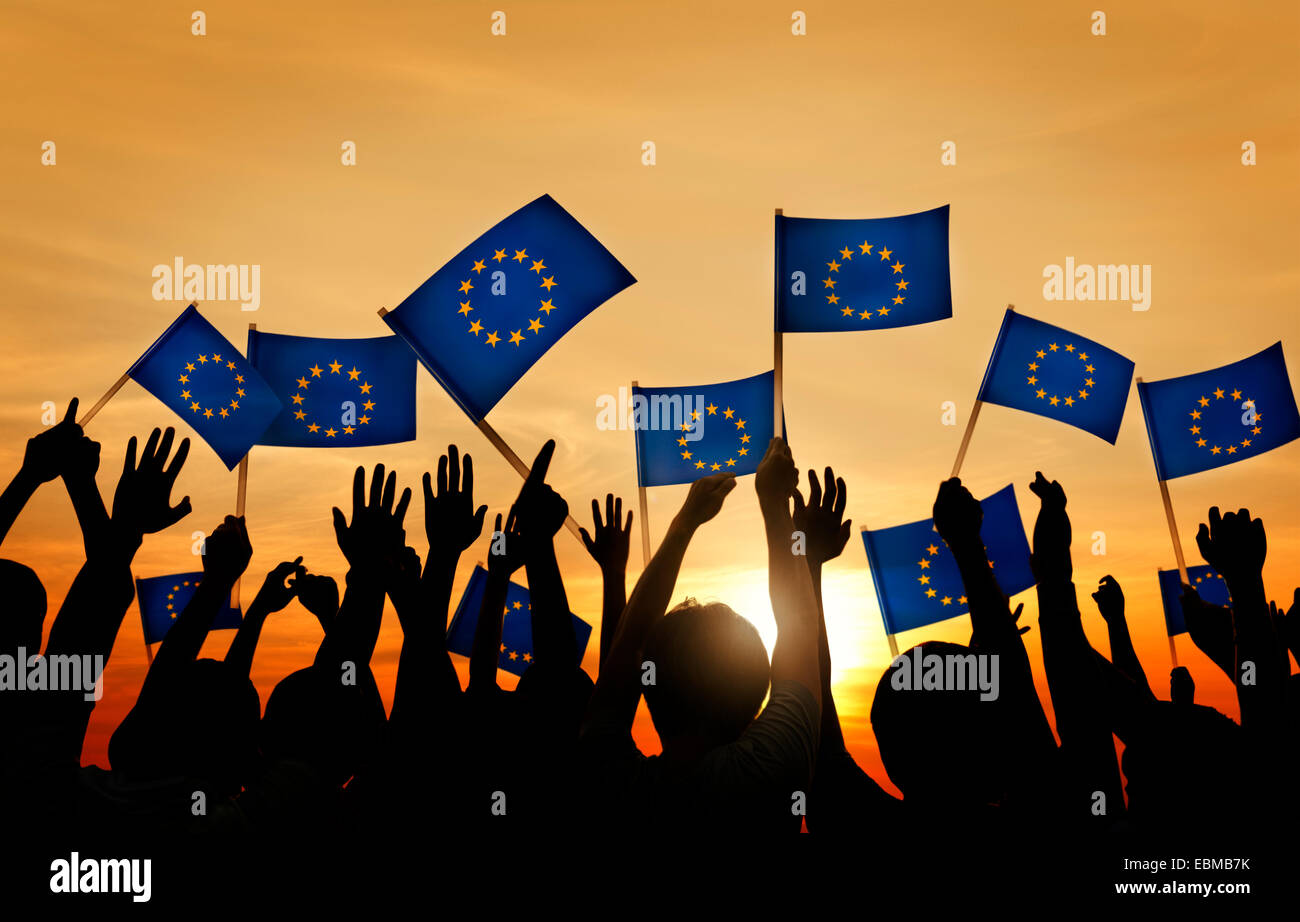 Group of People Waving European Union Flags in Back Lit Stock Photo - Alamy