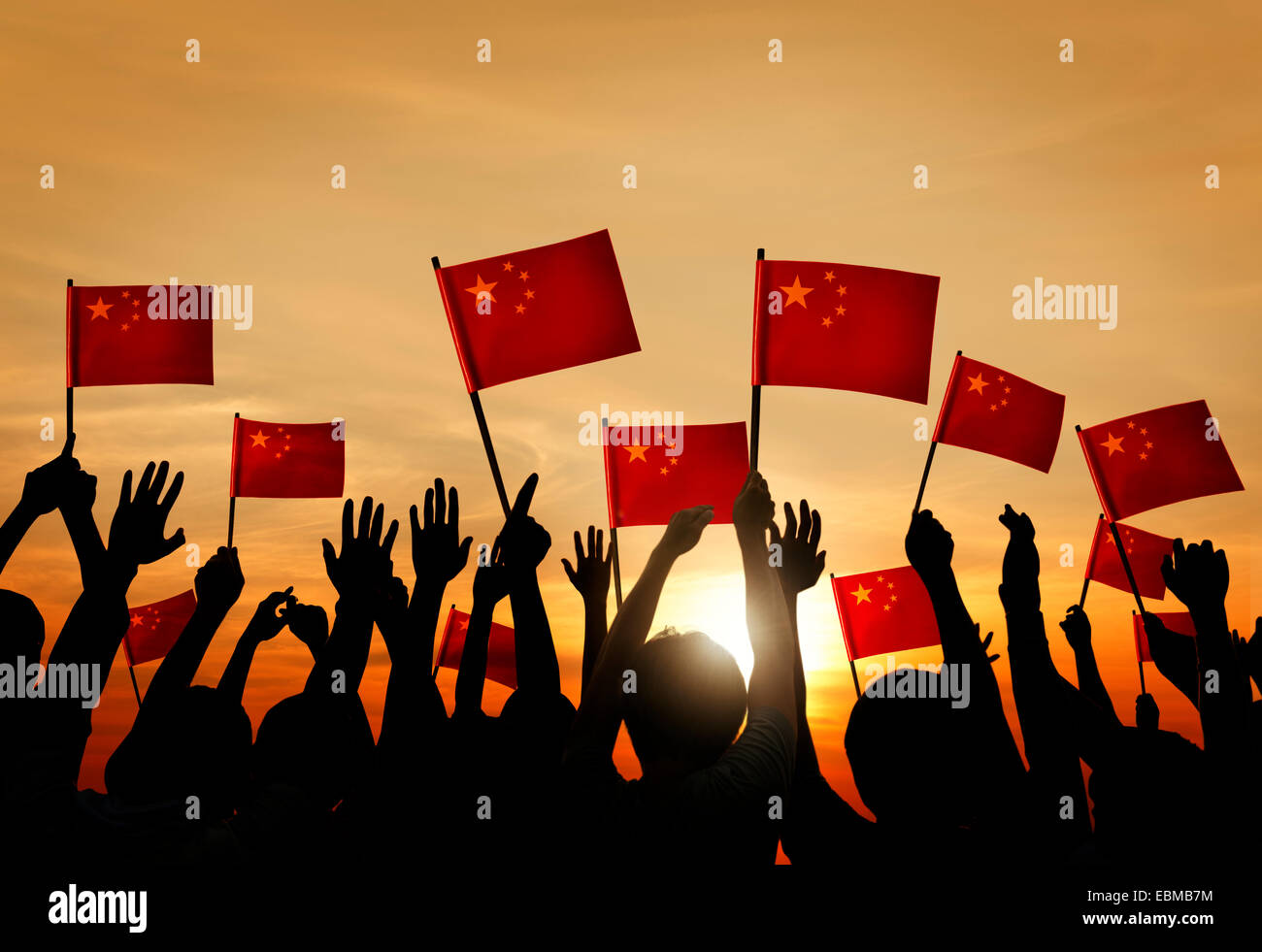 Group of People Waving Chinese Flags in Back Lit Stock Photo - Alamy
