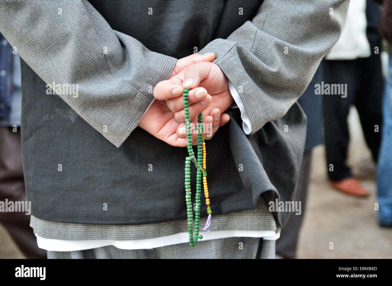 Man holding prayer beads hi-res stock photography and images - Alamy
