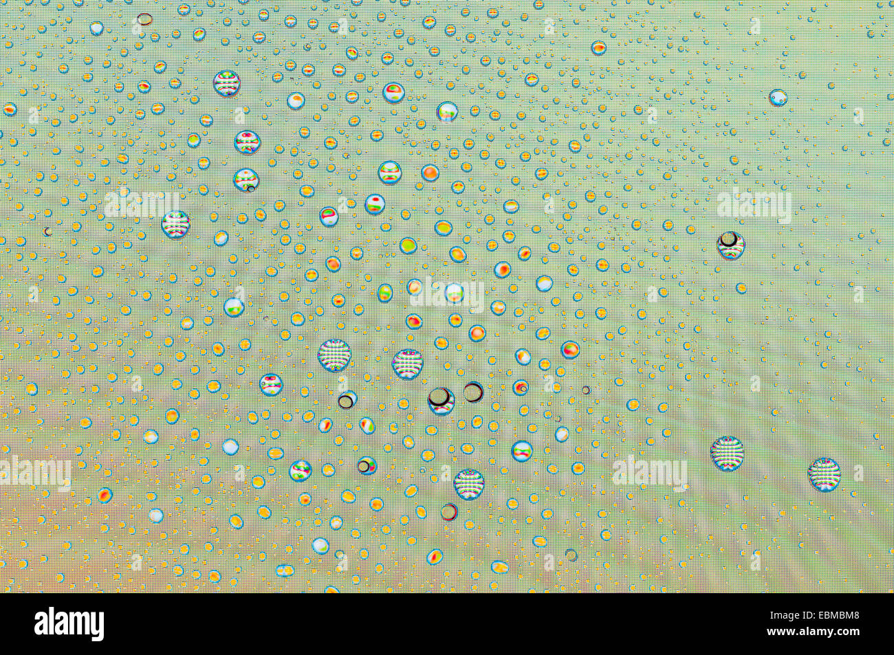 Close up of water droplets on a computer screen. Can be useful in ...