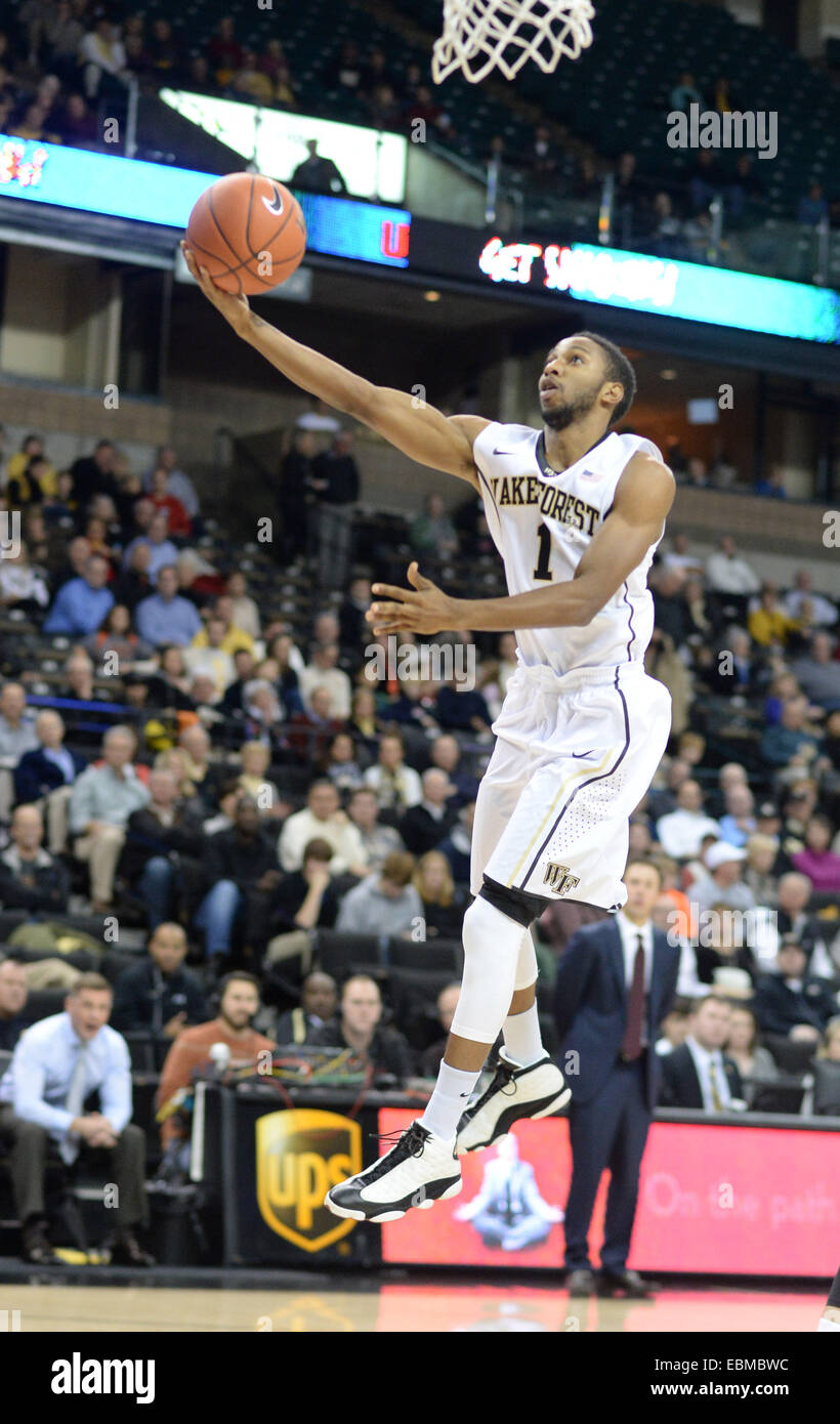 Winston-Salem, NC, USA. 26th Nov, 2014. Wake Forest Demon Deacons guard Madison Jones #1 lays ...