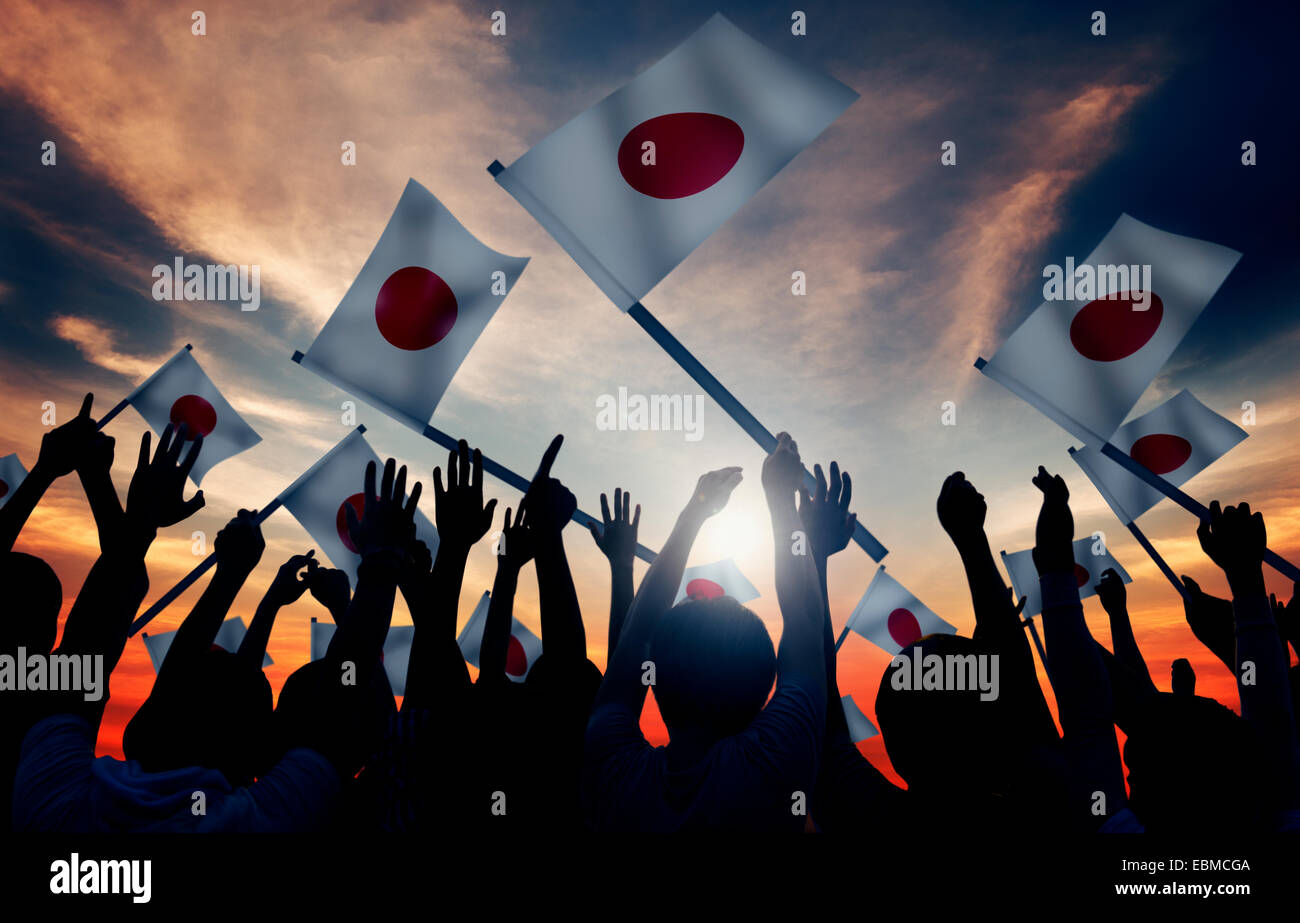 Group of People Waving Japanese Flags in Back Lit Stock Photo - Alamy