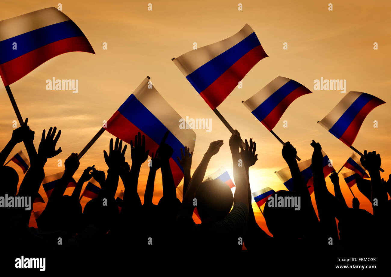 Silhouettes of People Holding Flag of Russia Stock Photo - Alamy